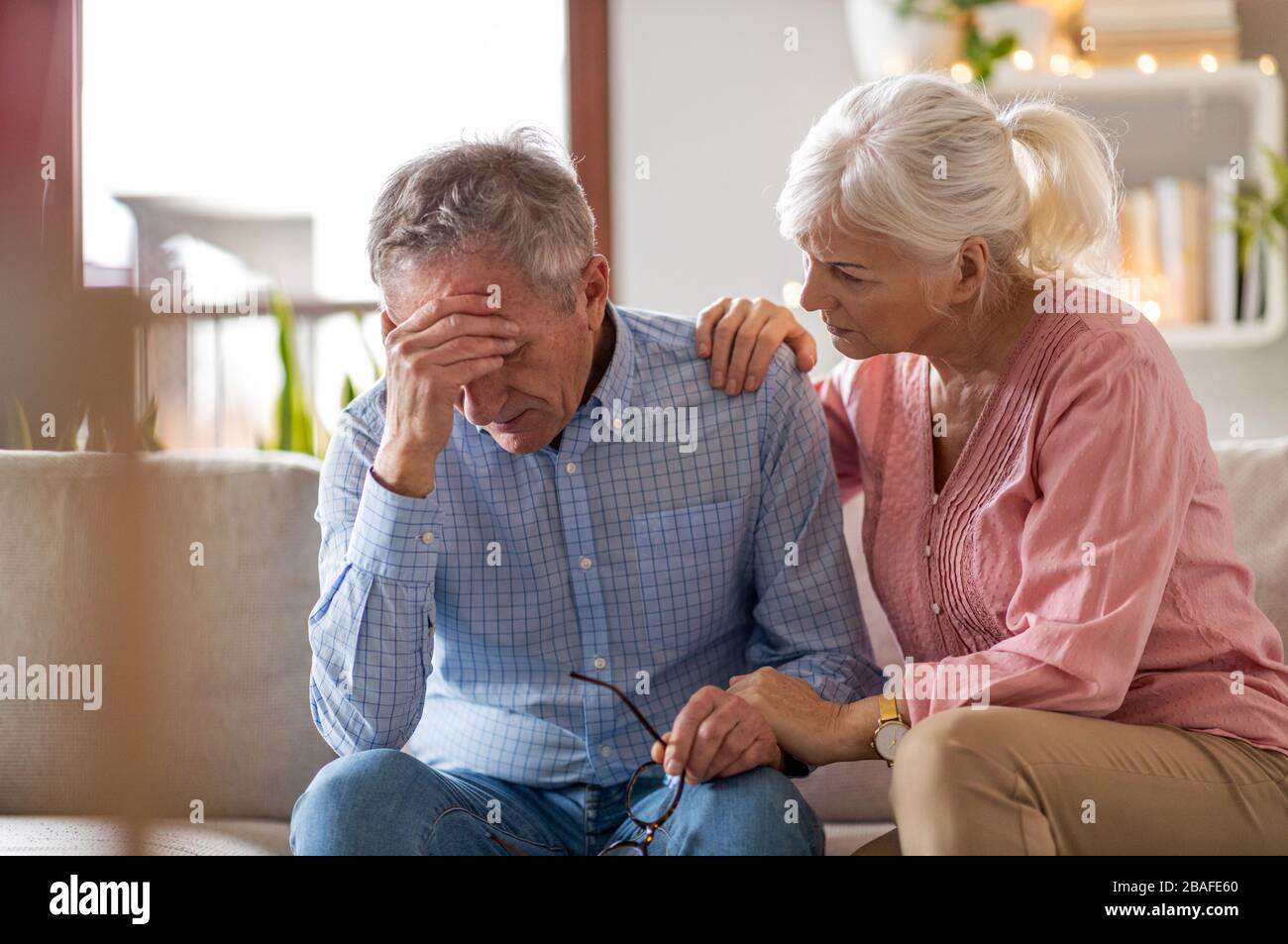 Husband comforting wife hi-res stock photography and images - Alamy