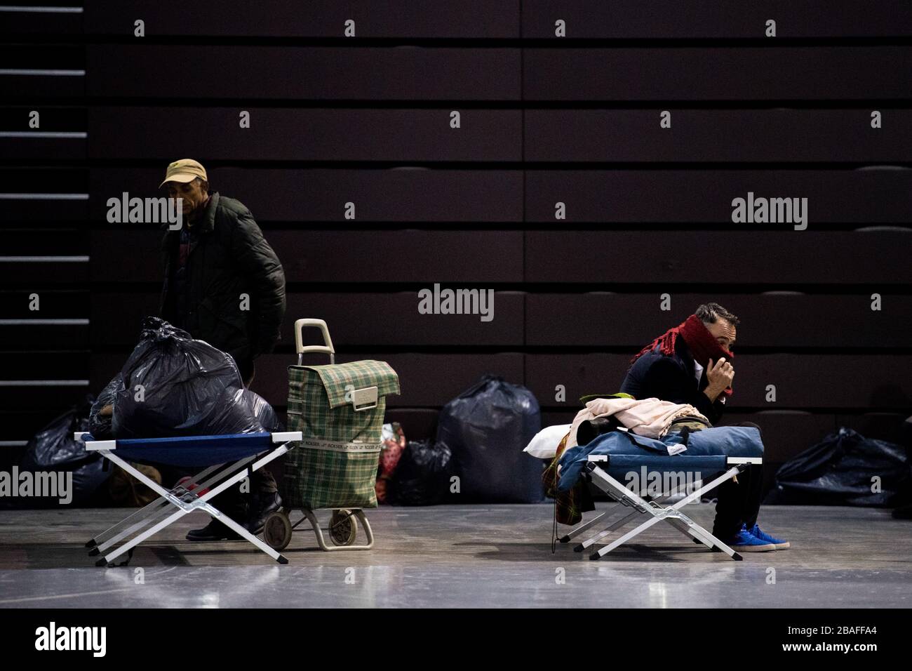 Granada, Spain. 27th Mar, 2020. Two homeless people seen inside the ...