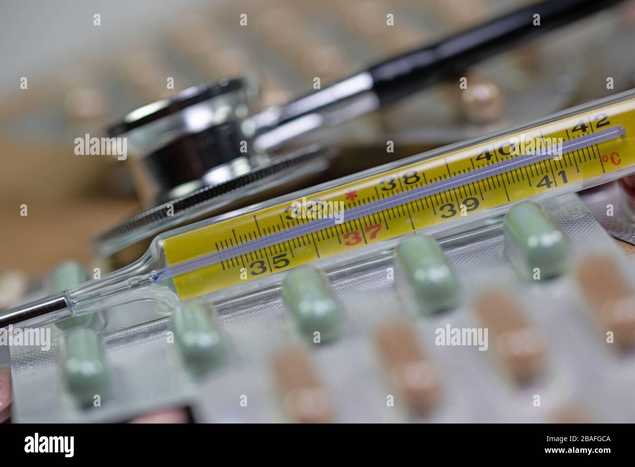 Medical thermometer, stethoscope and medication in a close-up Stock ...