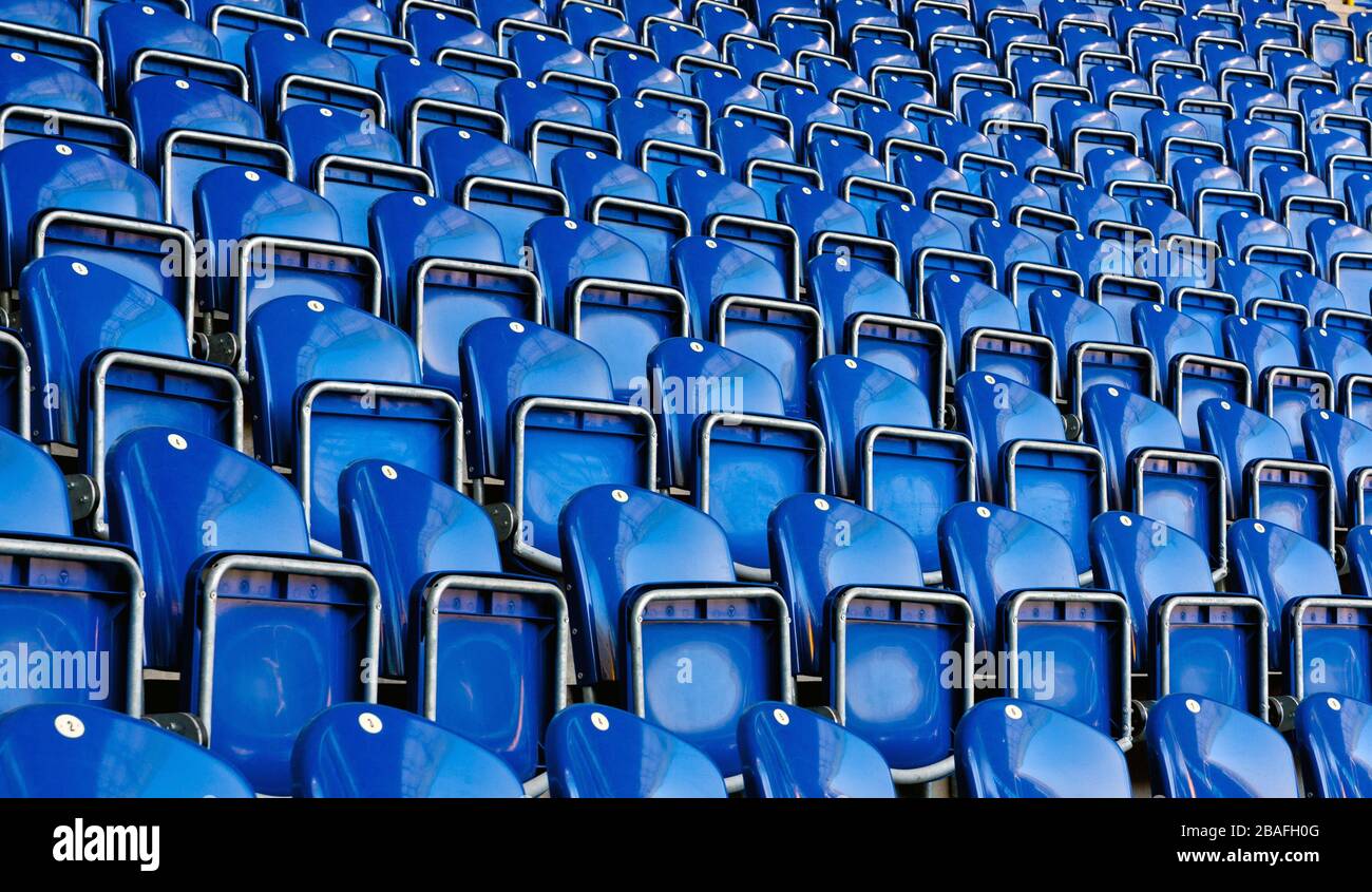 Blue seats on stadium Stock Photo - Alamy
