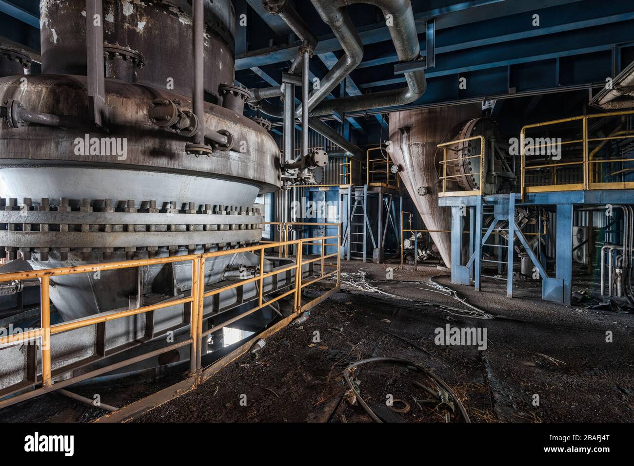 Interior of an old abandoned industrial steel factory Stock Photo - Alamy