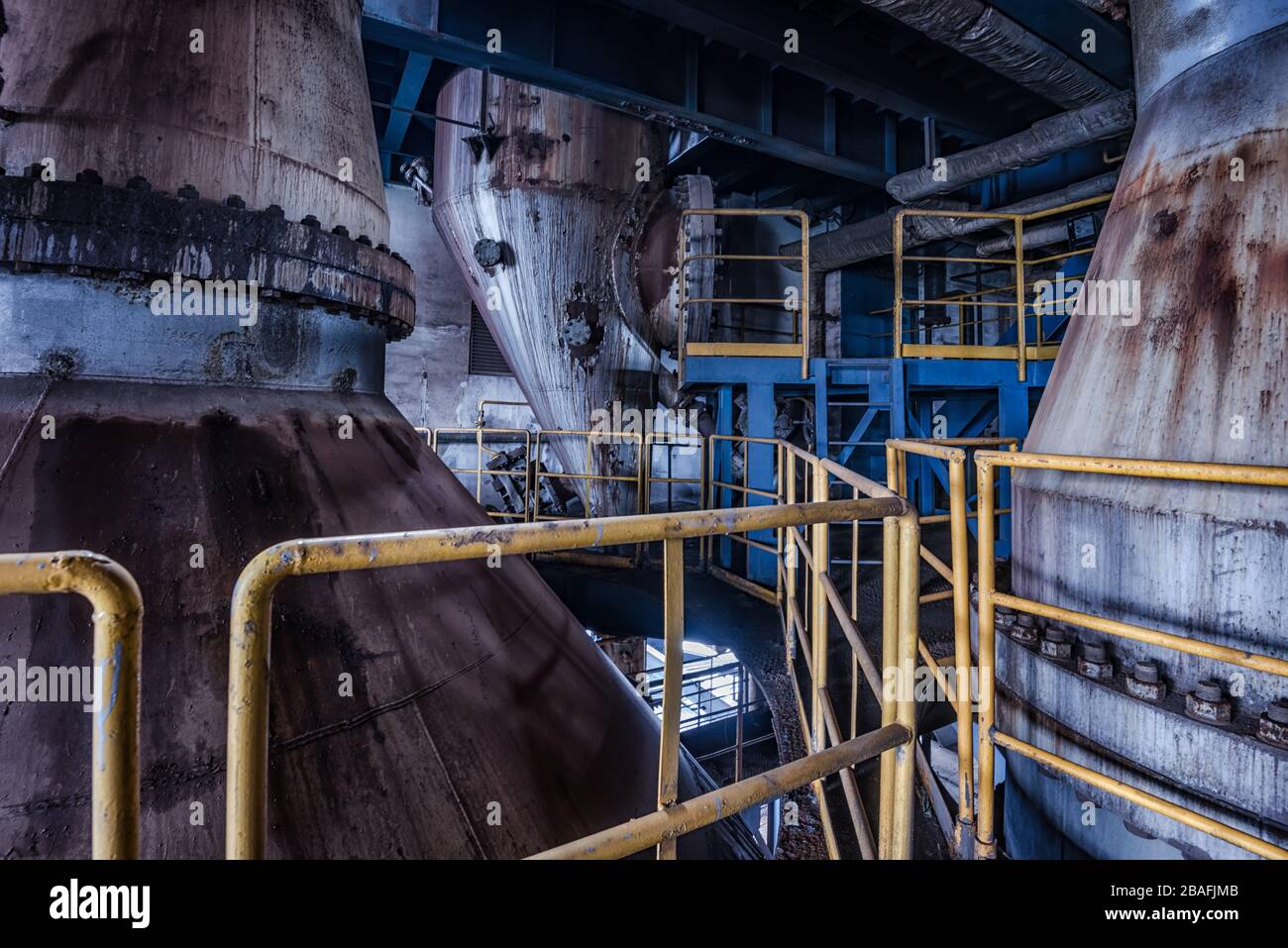 Interior of an old abandoned industrial steel factory Stock Photo - Alamy