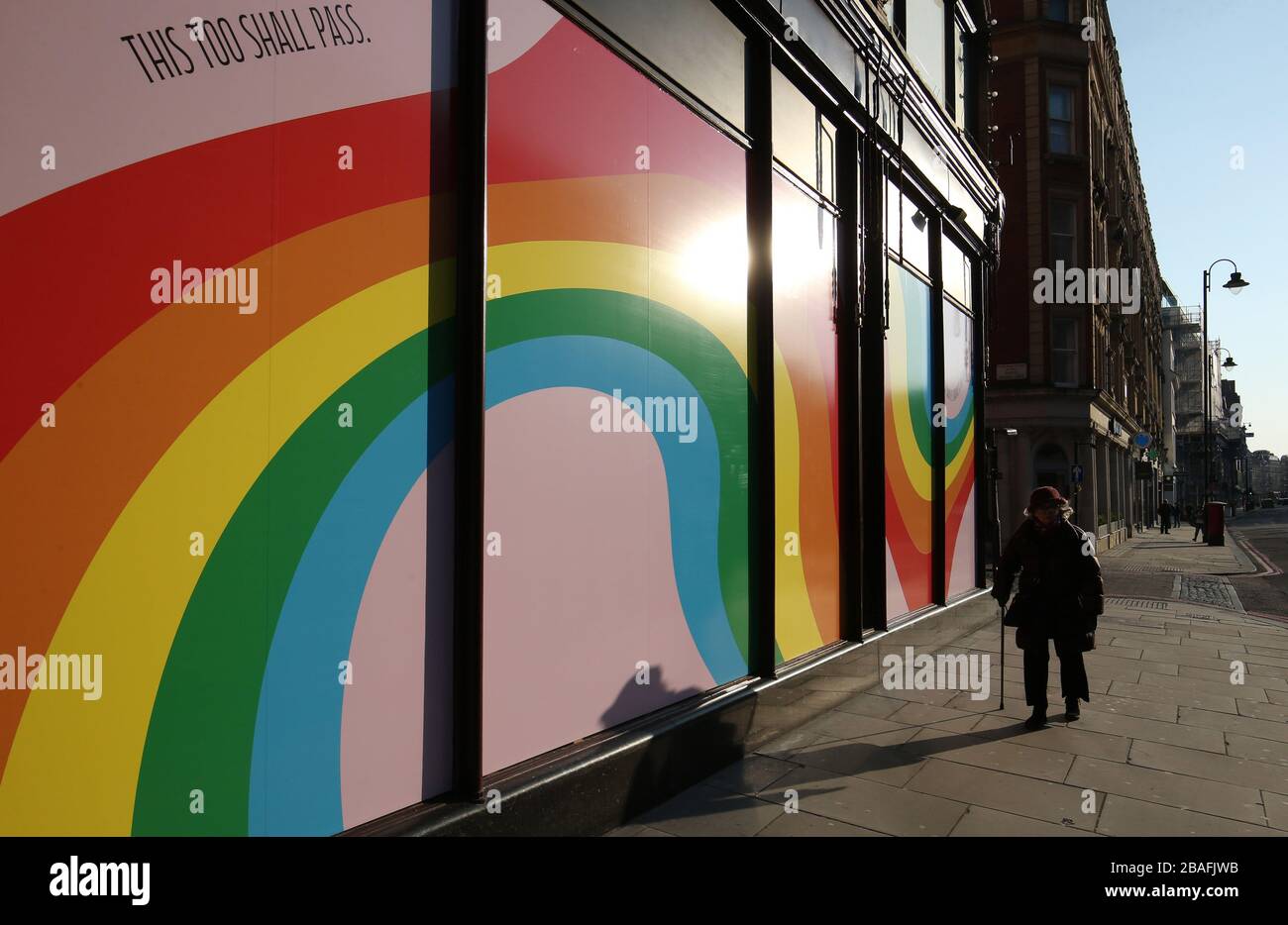 Rainbow displays adorn the windows of harrods department store hi-res ...