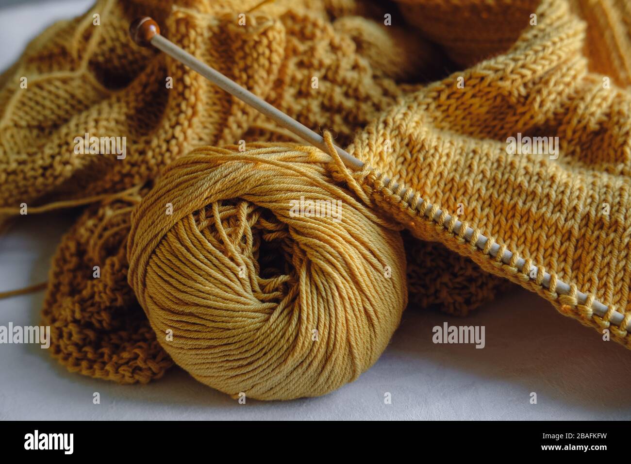 Yellow yarn ball hi-res stock photography and images - Alamy