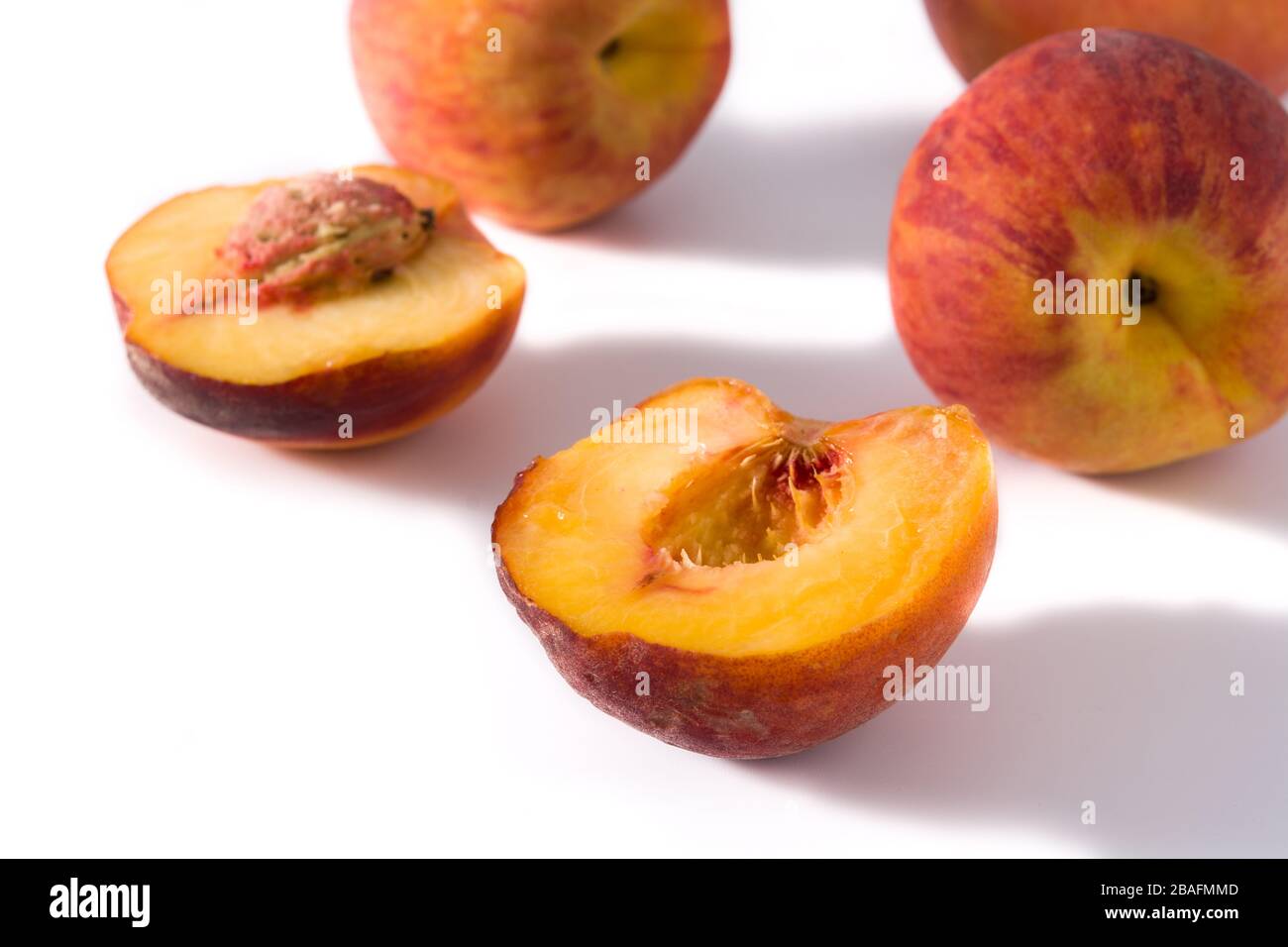 Pieces of peach fruit isolated on white background Stock Photo - Alamy