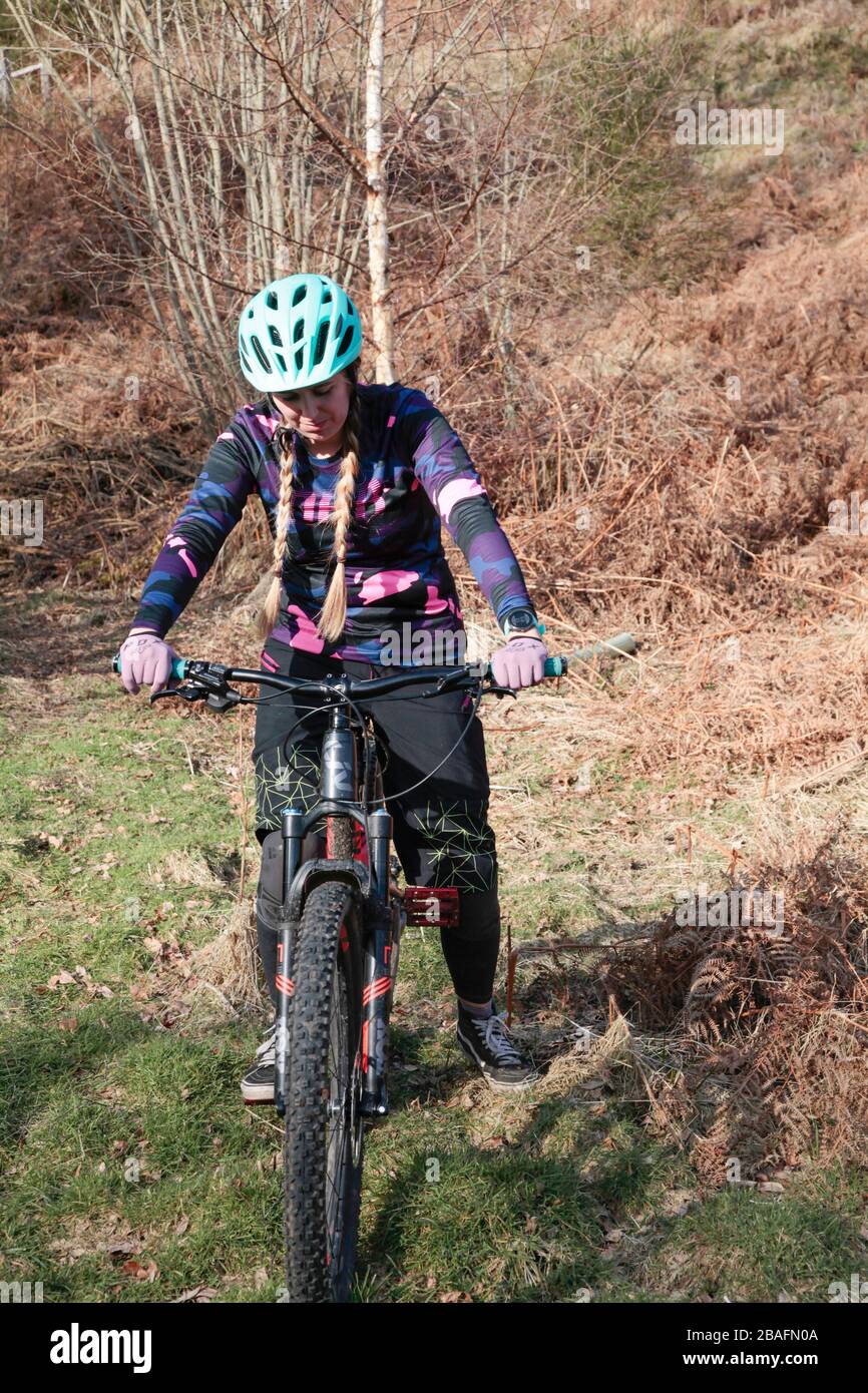 Woman riding bike helmet hi-res stock photography and images - Alamy