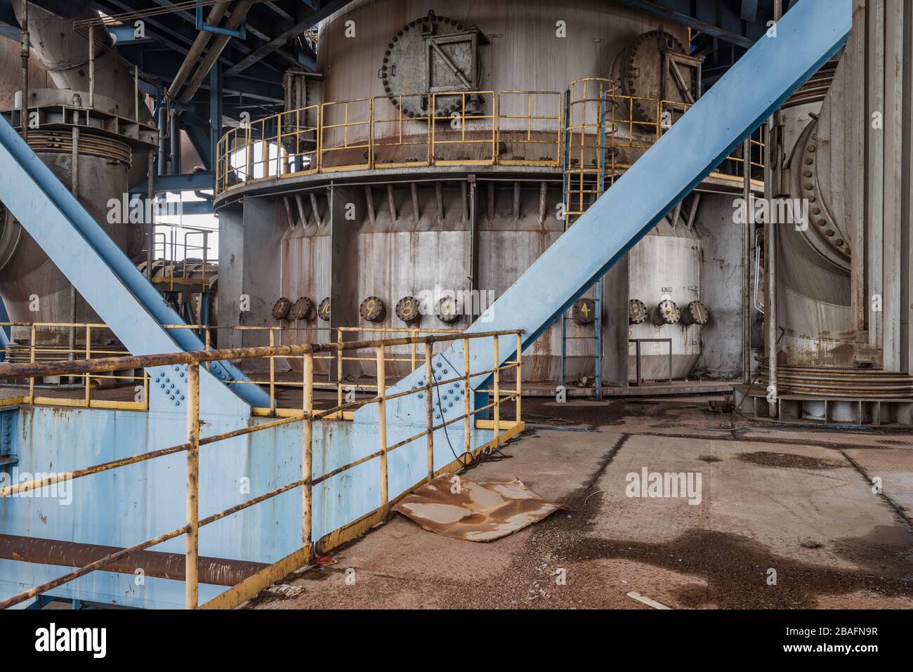 Interior of an old abandoned industrial steel factory Stock Photo - Alamy