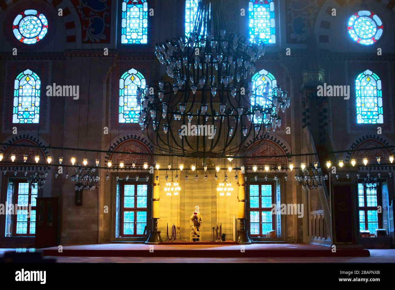 Islamic religious leader, an Imam, preparing to recite the daily ...