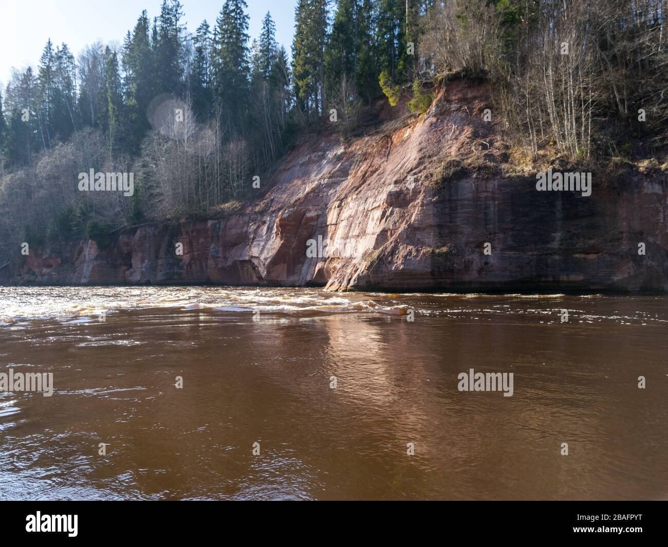 charming spring landscape with sandstone cliffs on the river bank, fast ...
