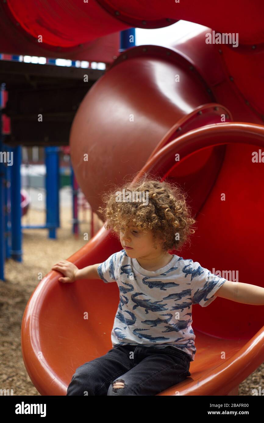 Boy slide hair hi-res stock photography and images - Alamy