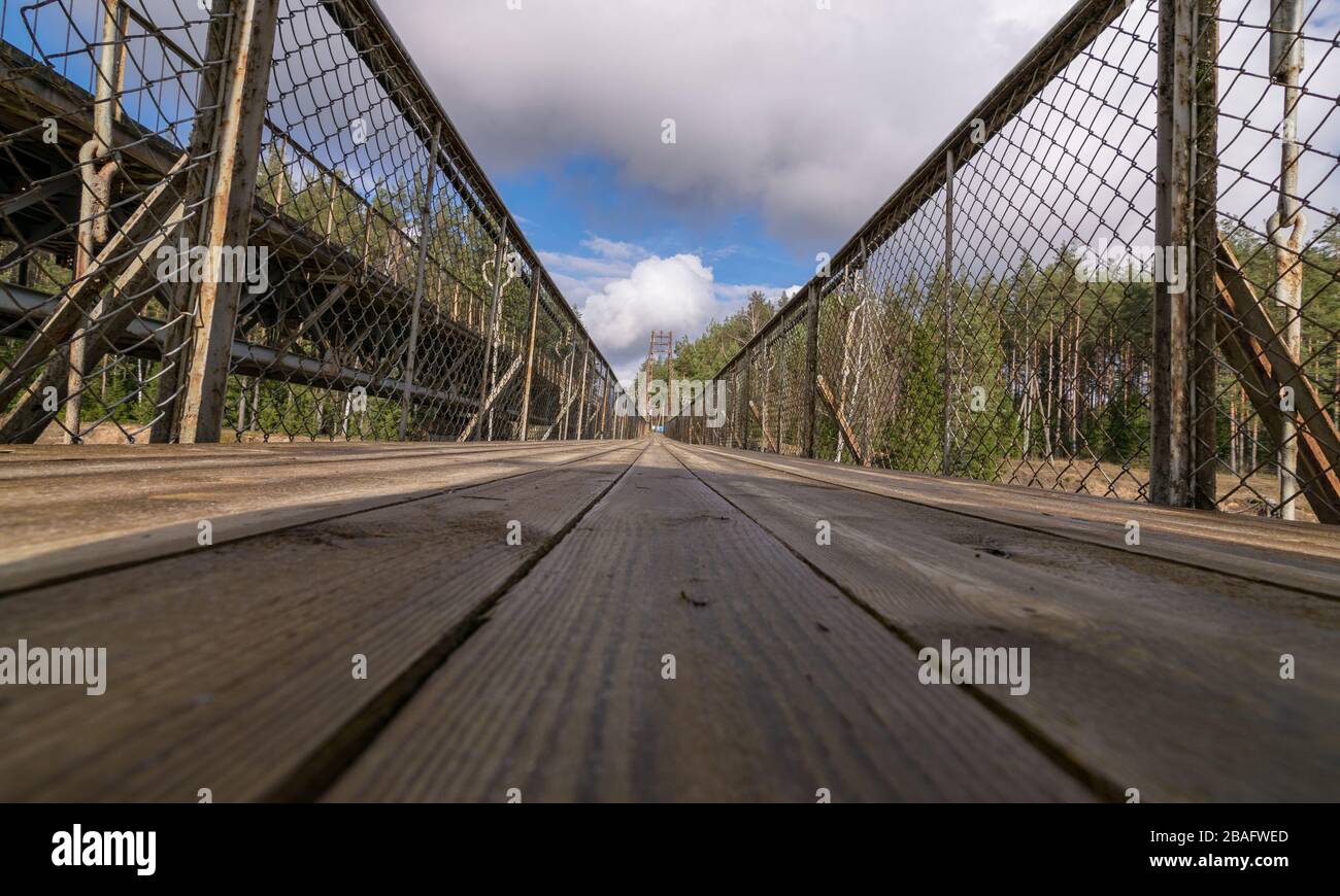 beautiful spring landscape with a cable bridge over the river. River ...