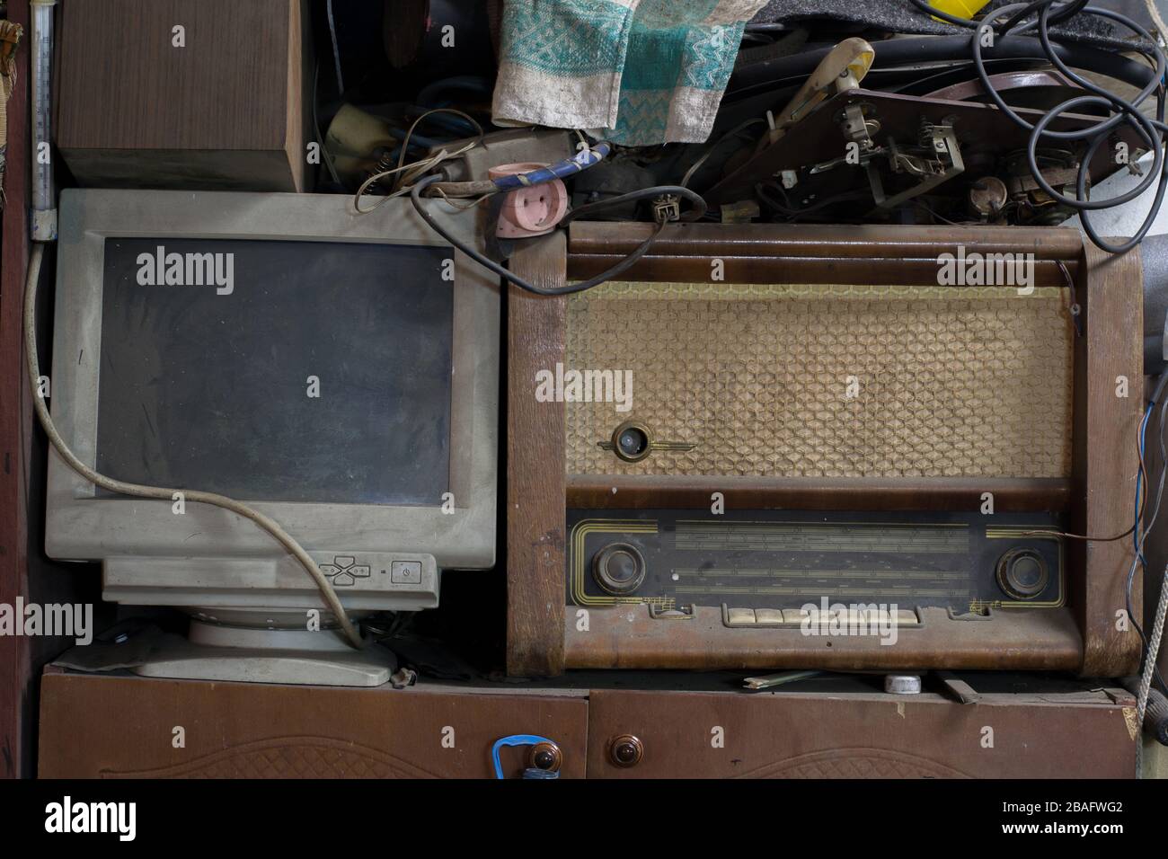 Old abandoned radio and computer standing near, technology stretching ...