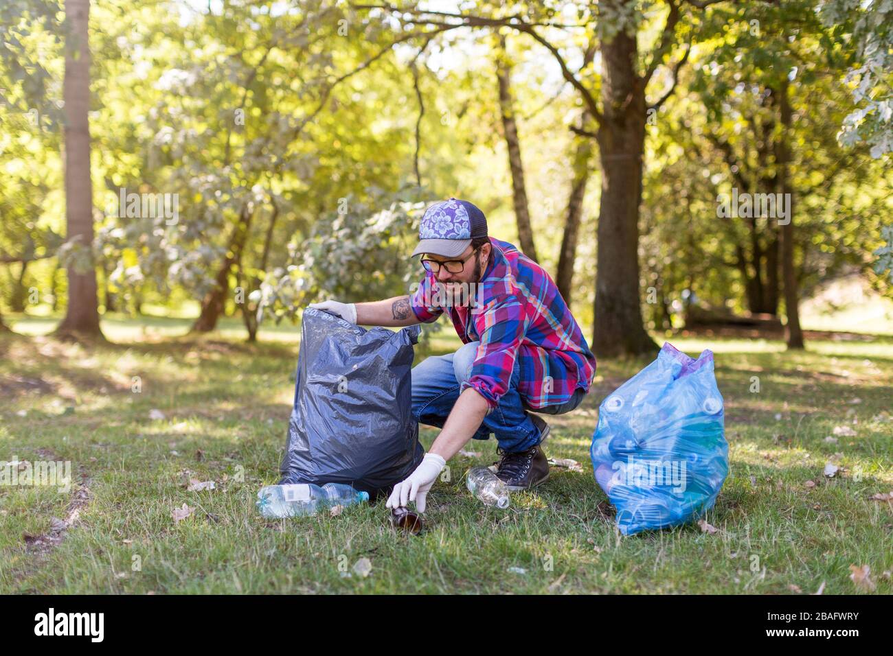 Man Picking Up Trash