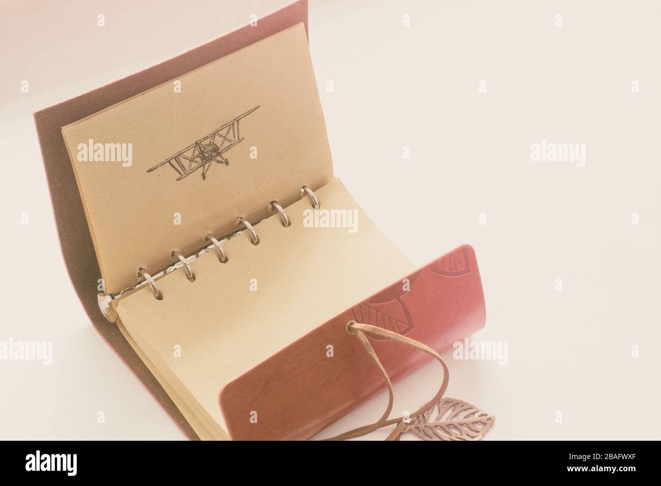 Leather notebook with black pen picture of an airplane. Ready for ...