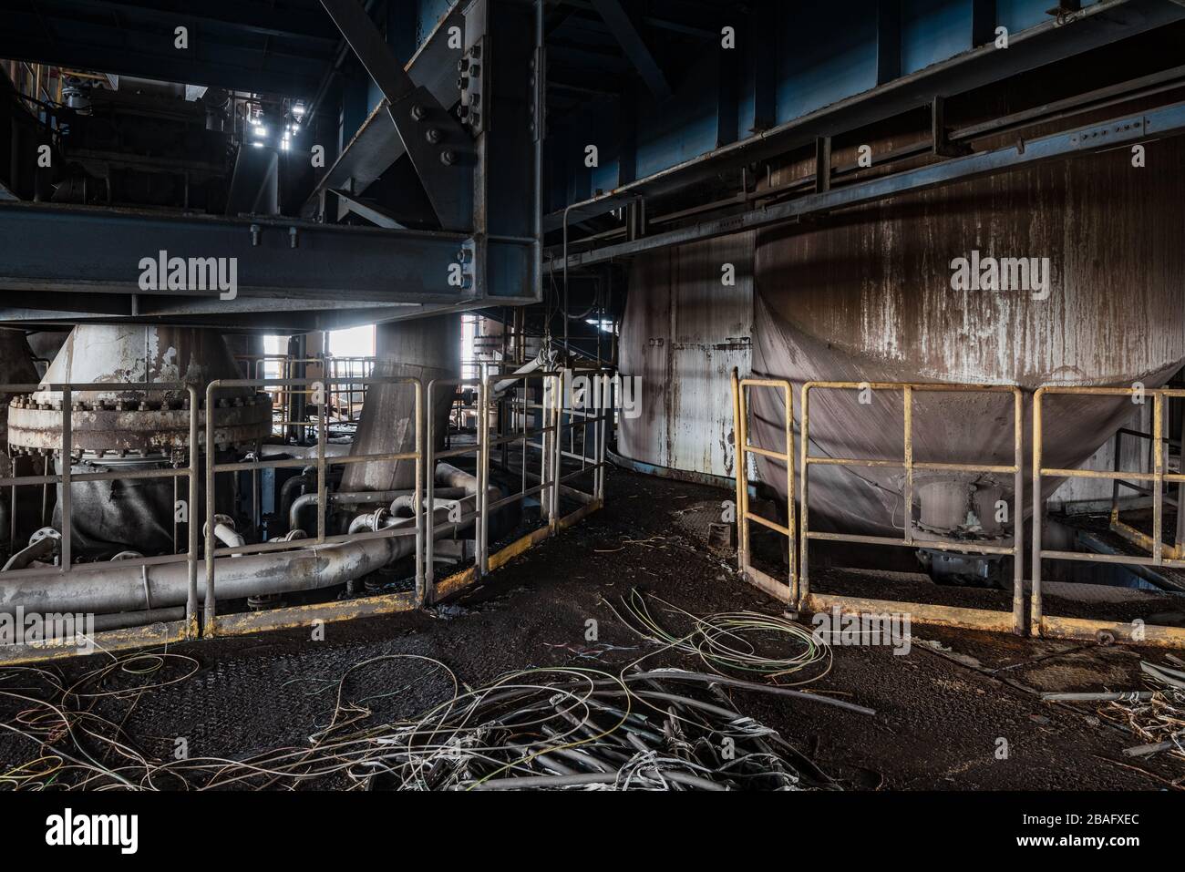 Interior of an old abandoned industrial steel factory Stock Photo - Alamy