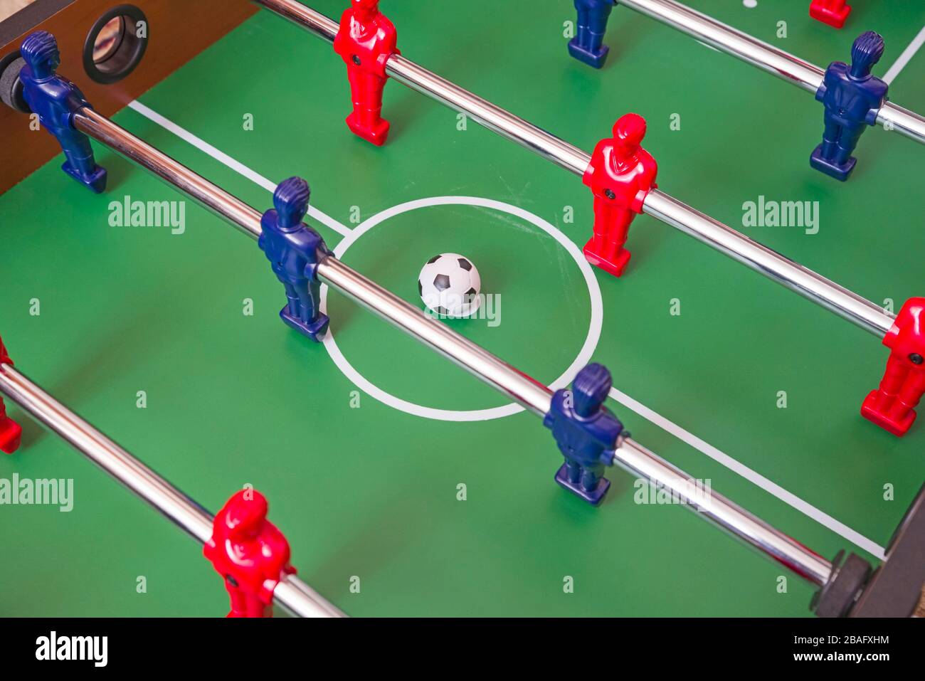 Soccer table game play in family Stock Photo - Alamy