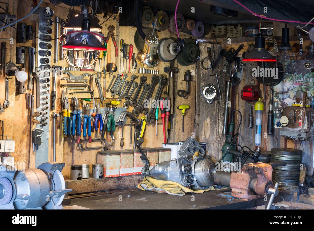 Motorcycle parts and tools on the desktop in the garage Stock Photo - Alamy