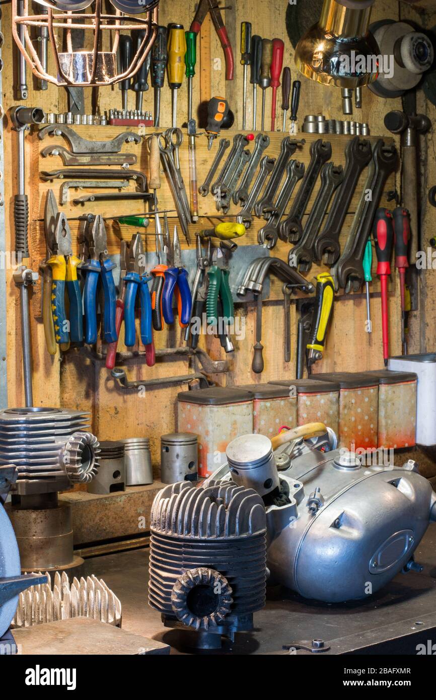 Motorcycle parts and tools on the desktop in the garage Stock Photo - Alamy