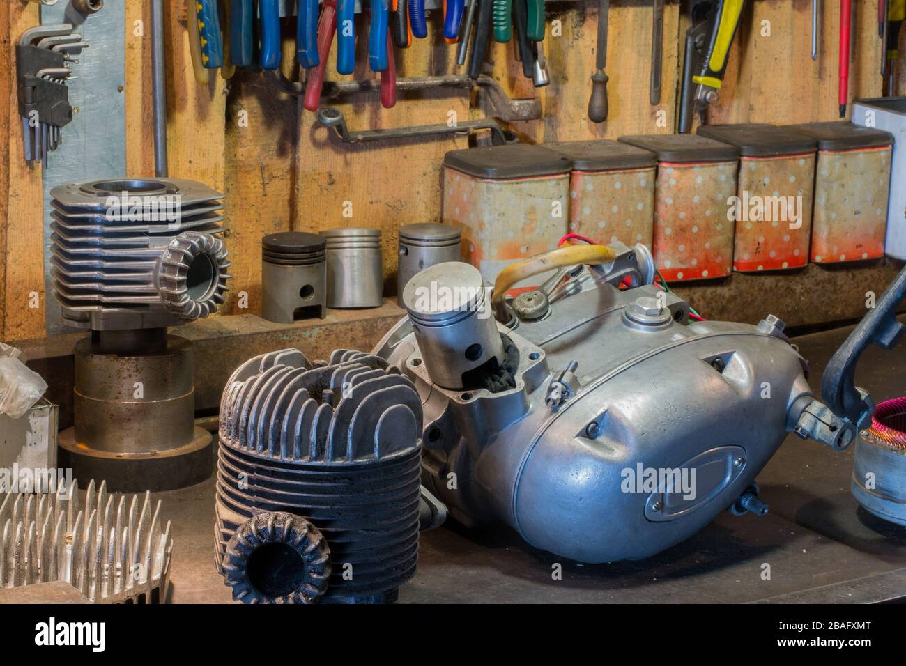 Motorcycle parts and tools on the desktop in the garage Stock Photo - Alamy