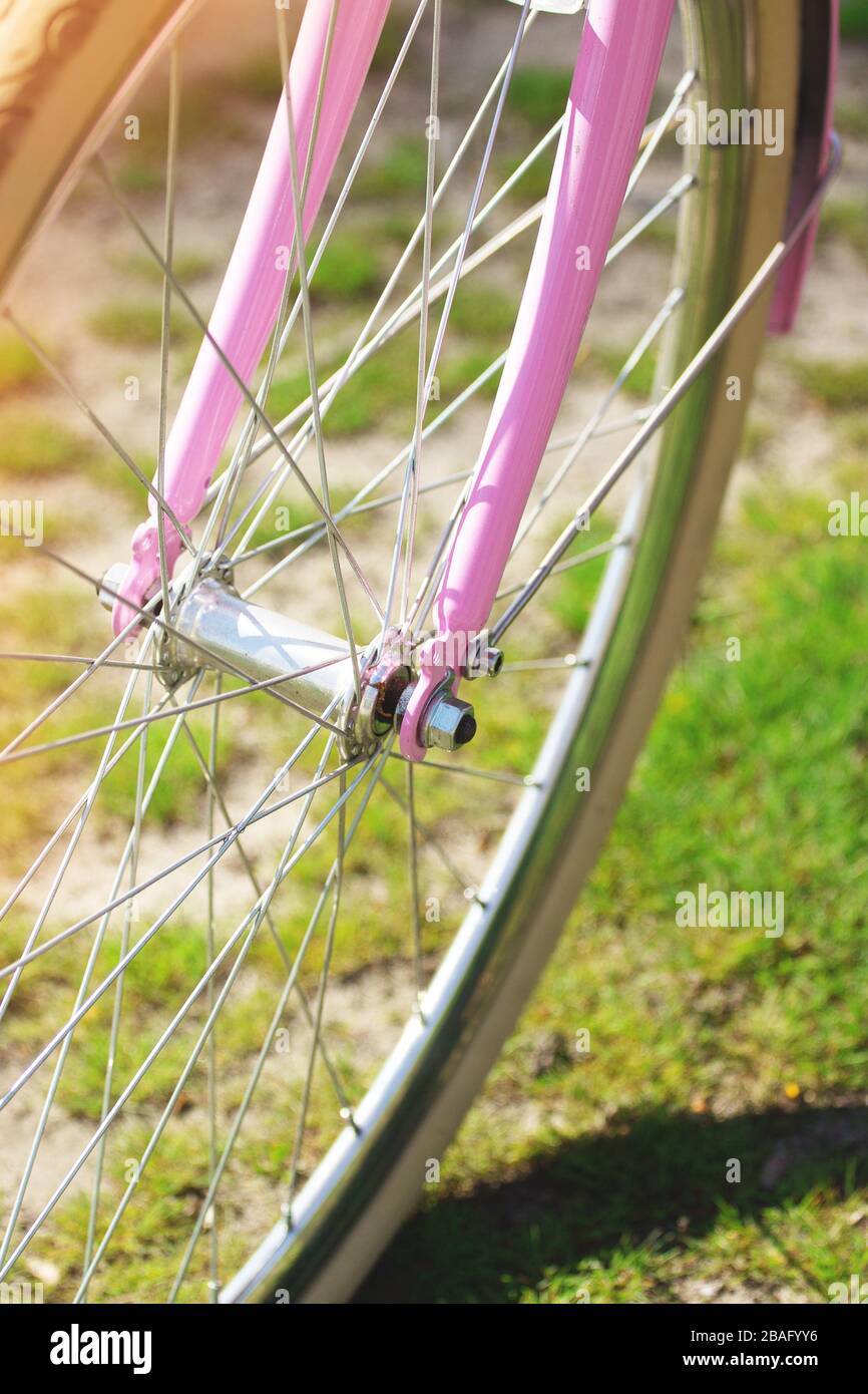 Stylish retro bike concept. Closeup photo of pink vintage bike wheel ...