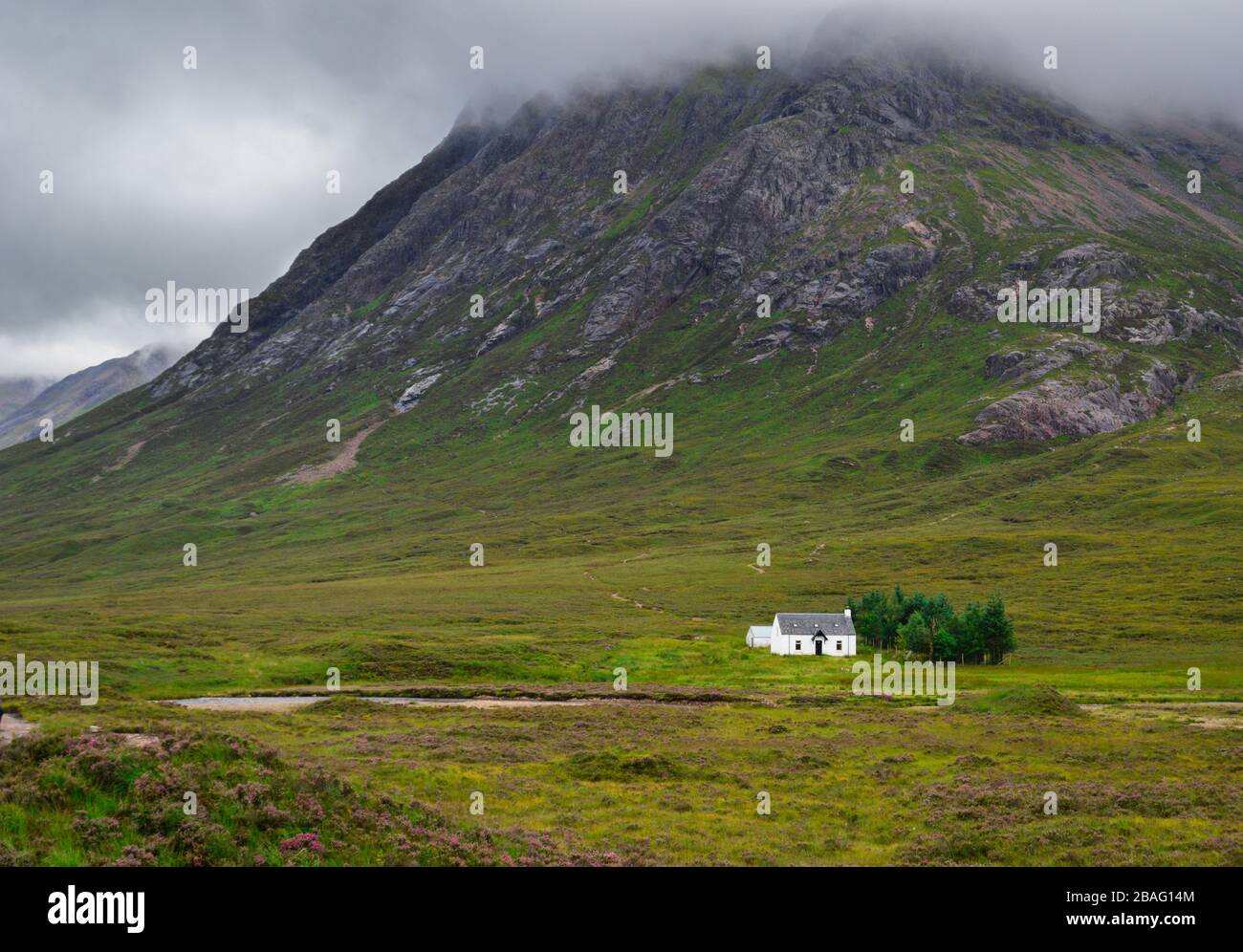 Little white house in the moor below Buachaille Etive Mòr, in Glencoe ...