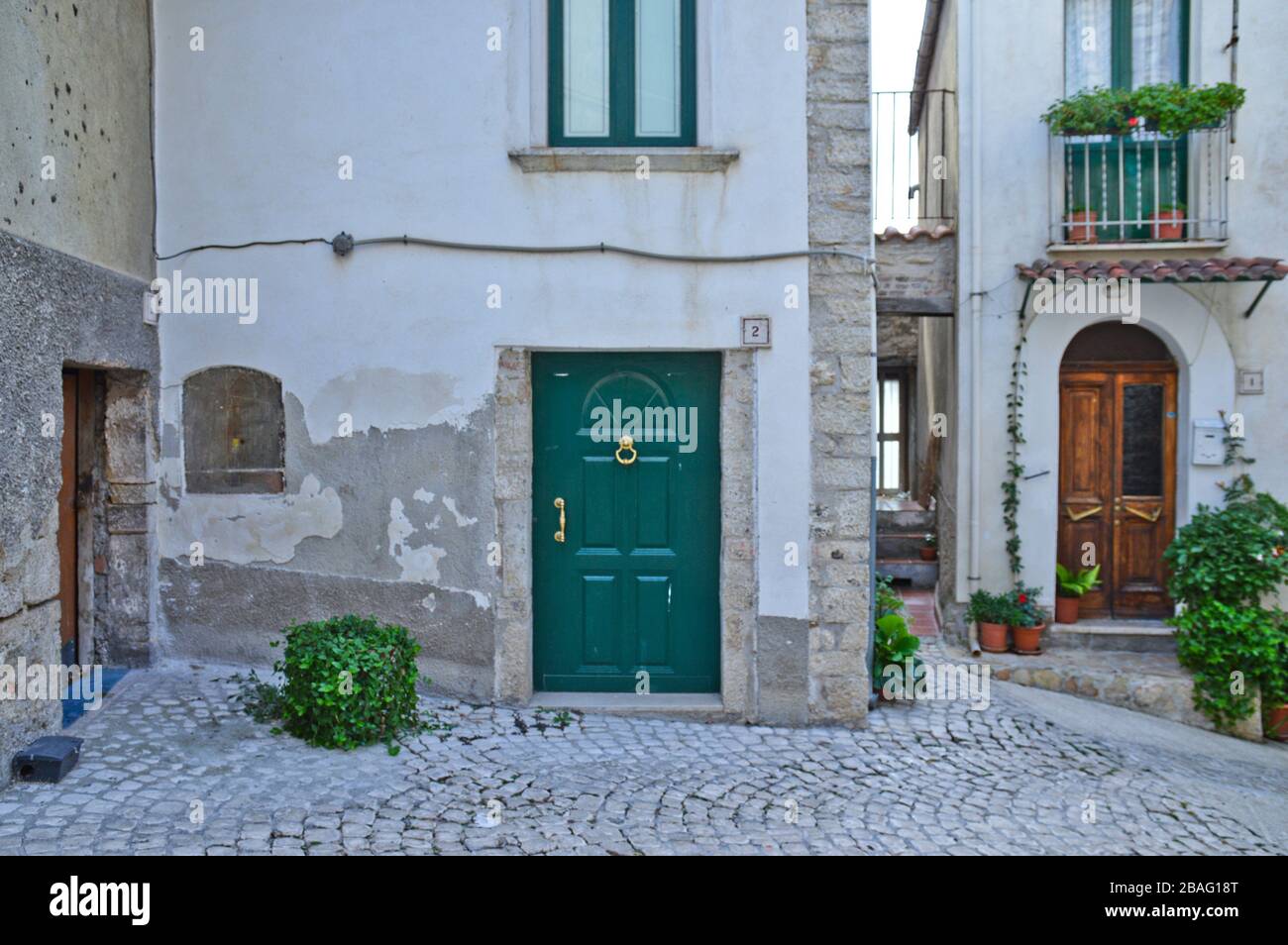 A narrow street between the old houses of Monteroduni, a village in the ...