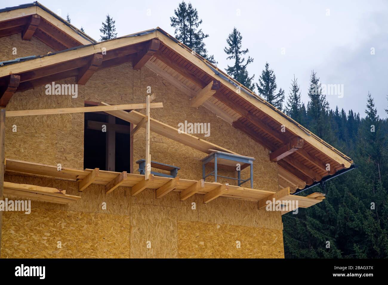 Wooden chalet construction in the forest, exterior works Stock Photo ...
