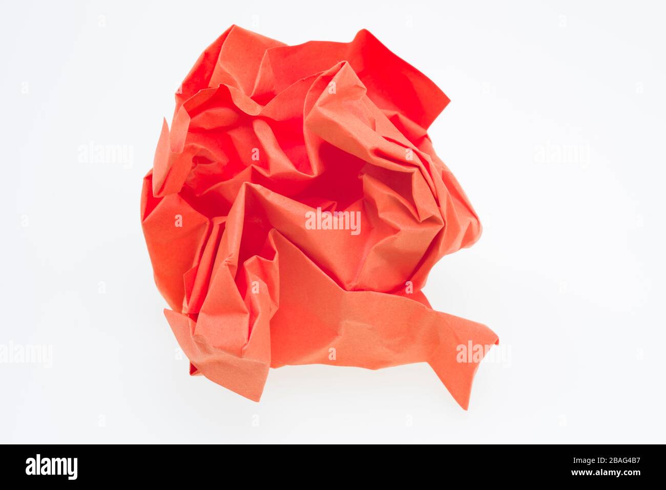 Red crumpled paper ball over a white background Stock Photo - Alamy
