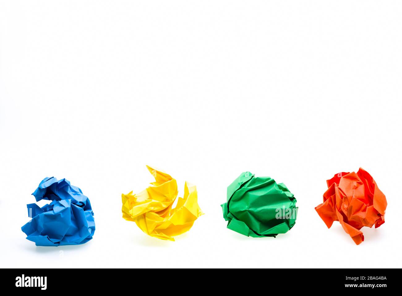 Colored crumpled paper ball, concept over white Stock Photo - Alamy