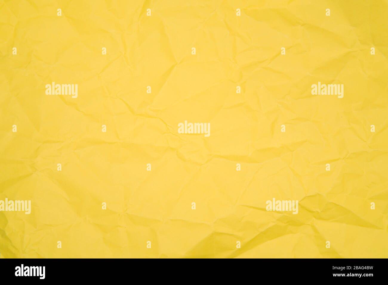 Texture of yellow crumpled paper, close image Stock Photo - Alamy
