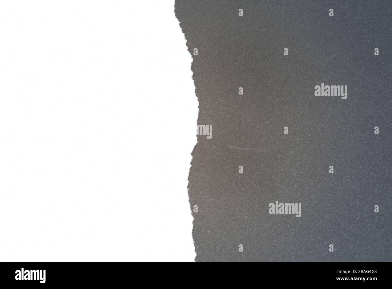 Half ripped white paper with black background Stock Photo - Alamy