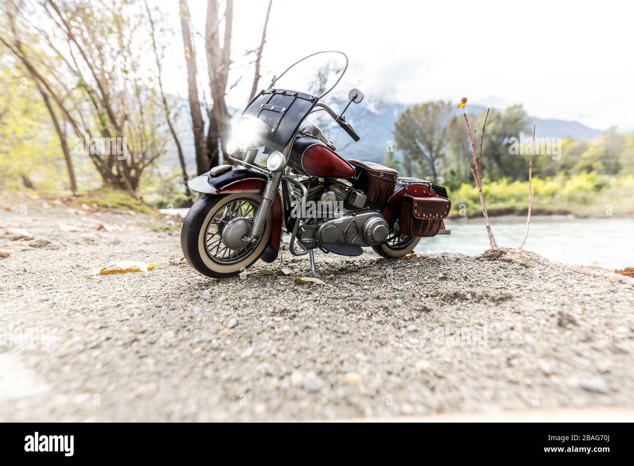 realistic composition with model of motorcycle in the countryside Stock ...
