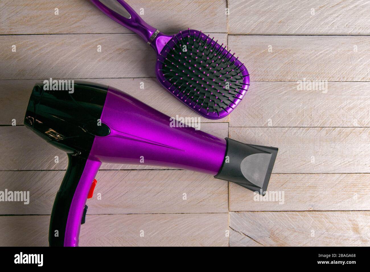 Professional hairdresser's set on white woodeb table, top view ...