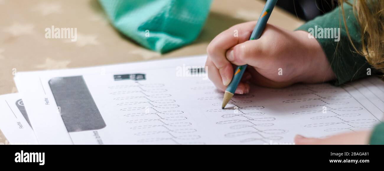 LITTLE GIRL HAND DOING HOMEWORK Stock Photo - Alamy