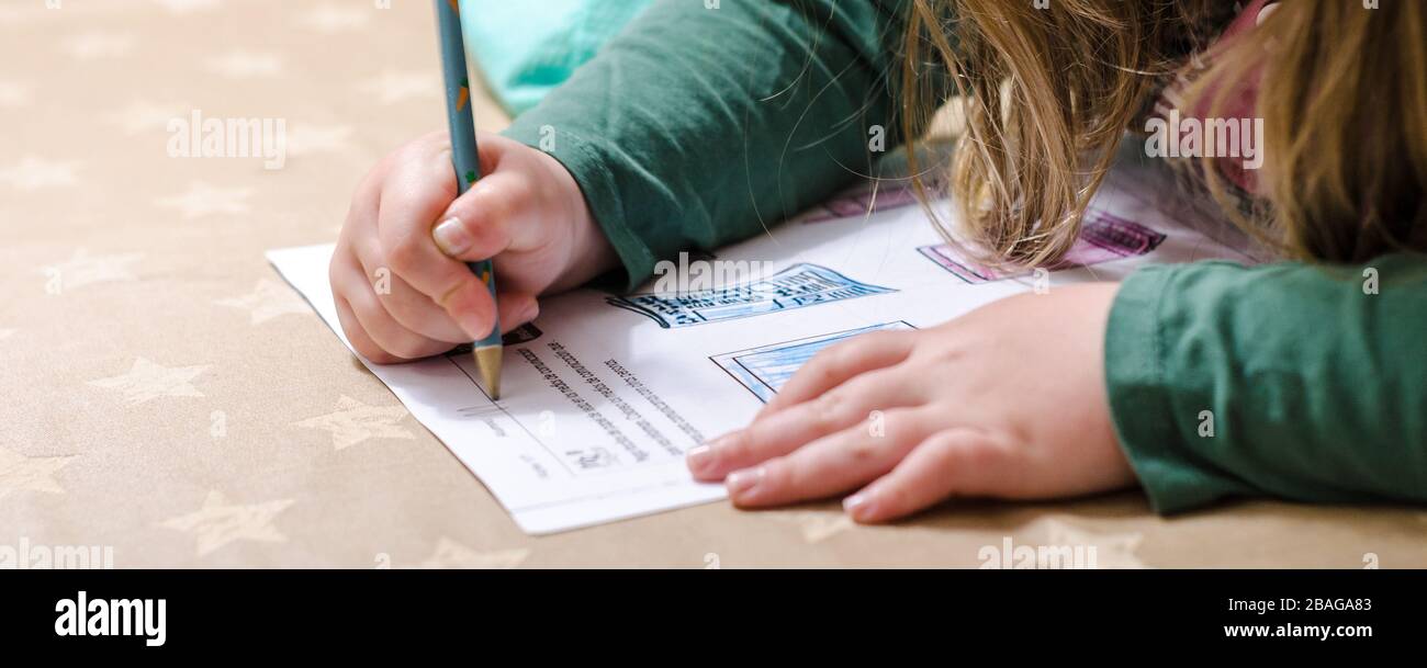 LITTLE GIRL HAND DOING HOMEWORK Stock Photo - Alamy