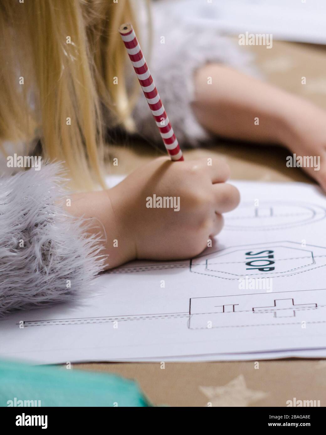 LITTLE GIRL HAND DOING HOMEWORK Stock Photo - Alamy