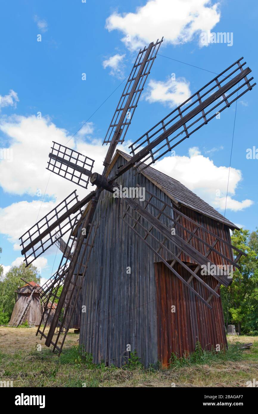 old windmill on rural meadow Stock Photo - Alamy
