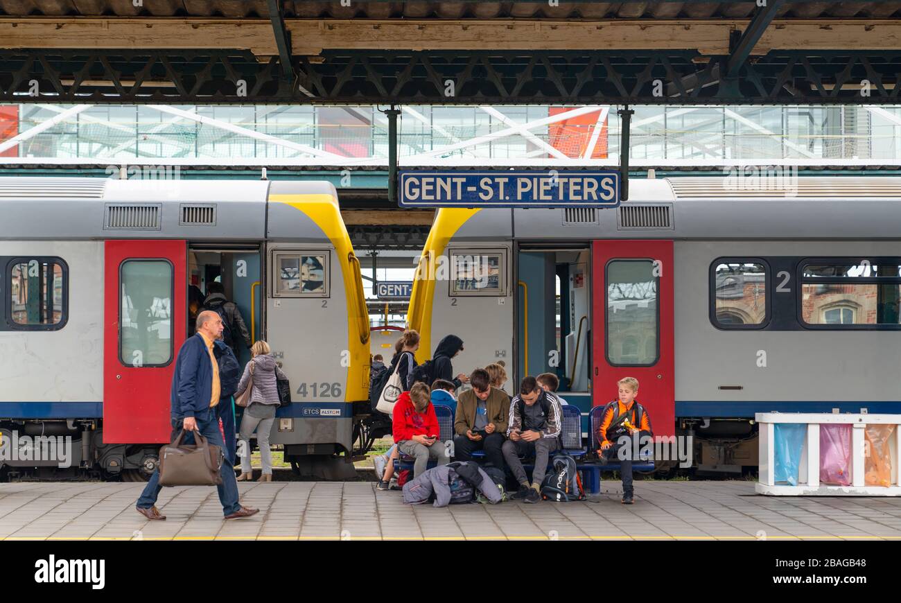 Ghent/Belgium - October 10, 2019: People getting on the train at the ...