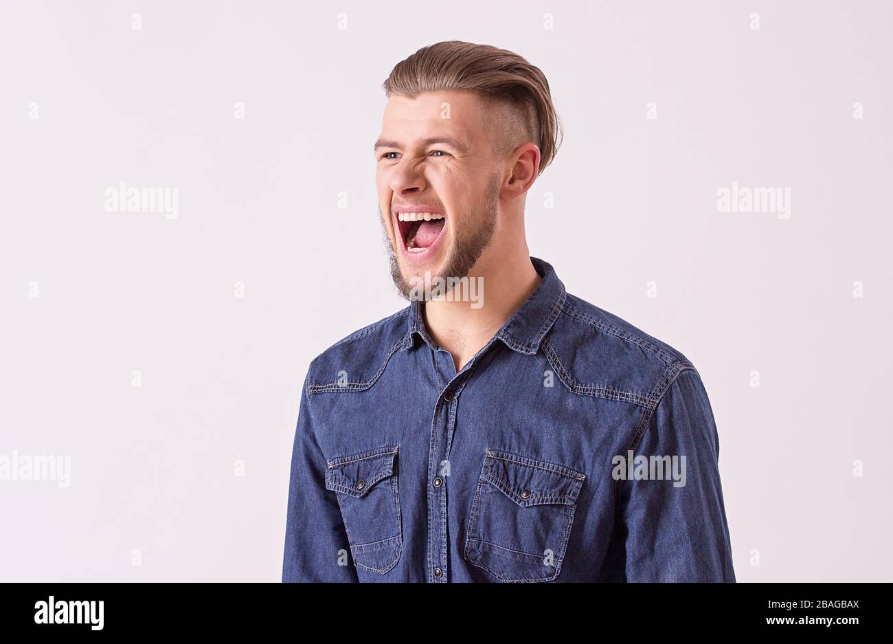 Side profile young man screaming hi-res stock photography and images ...