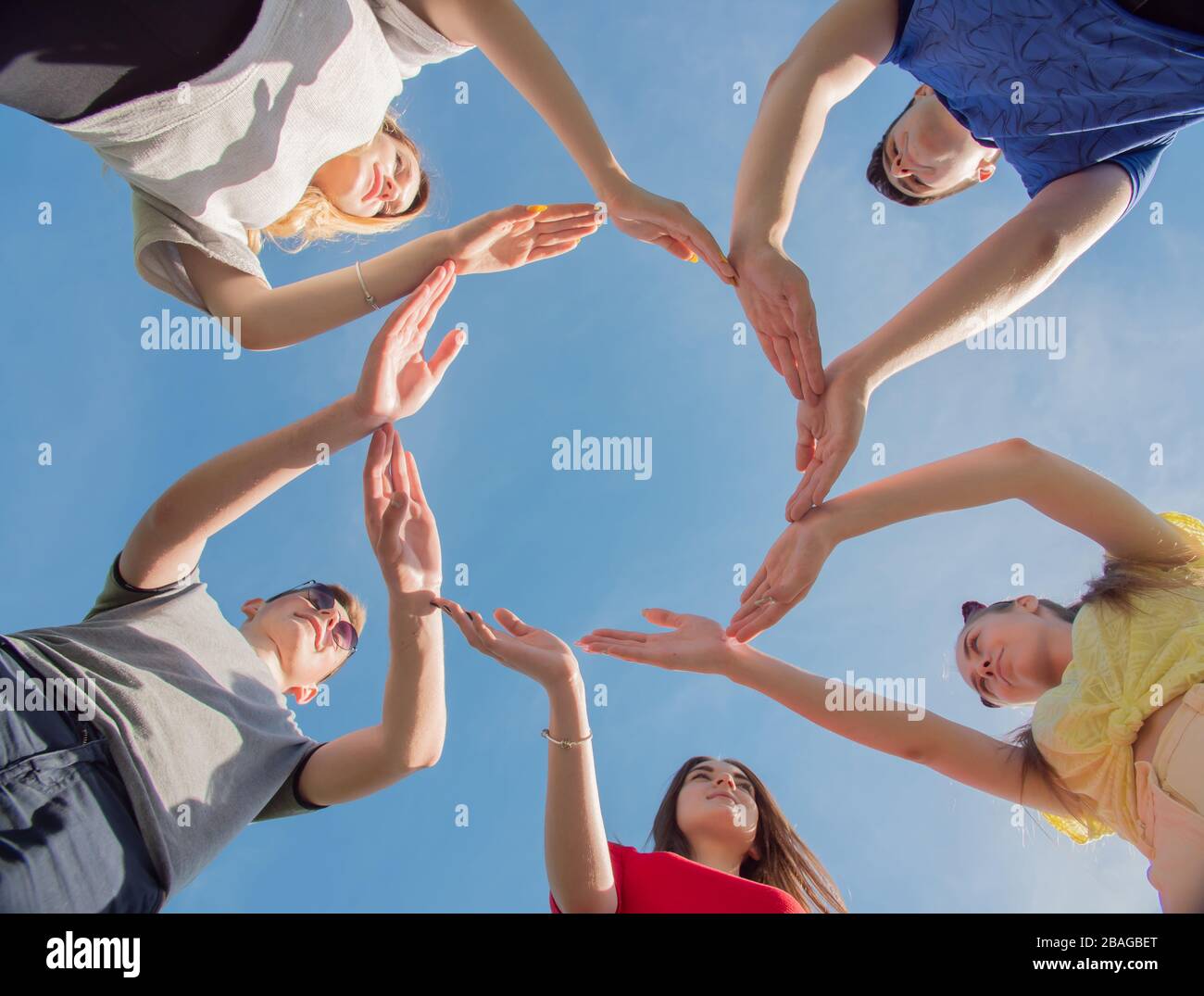 Multiracial hands making a circle hi-res stock photography and images ...