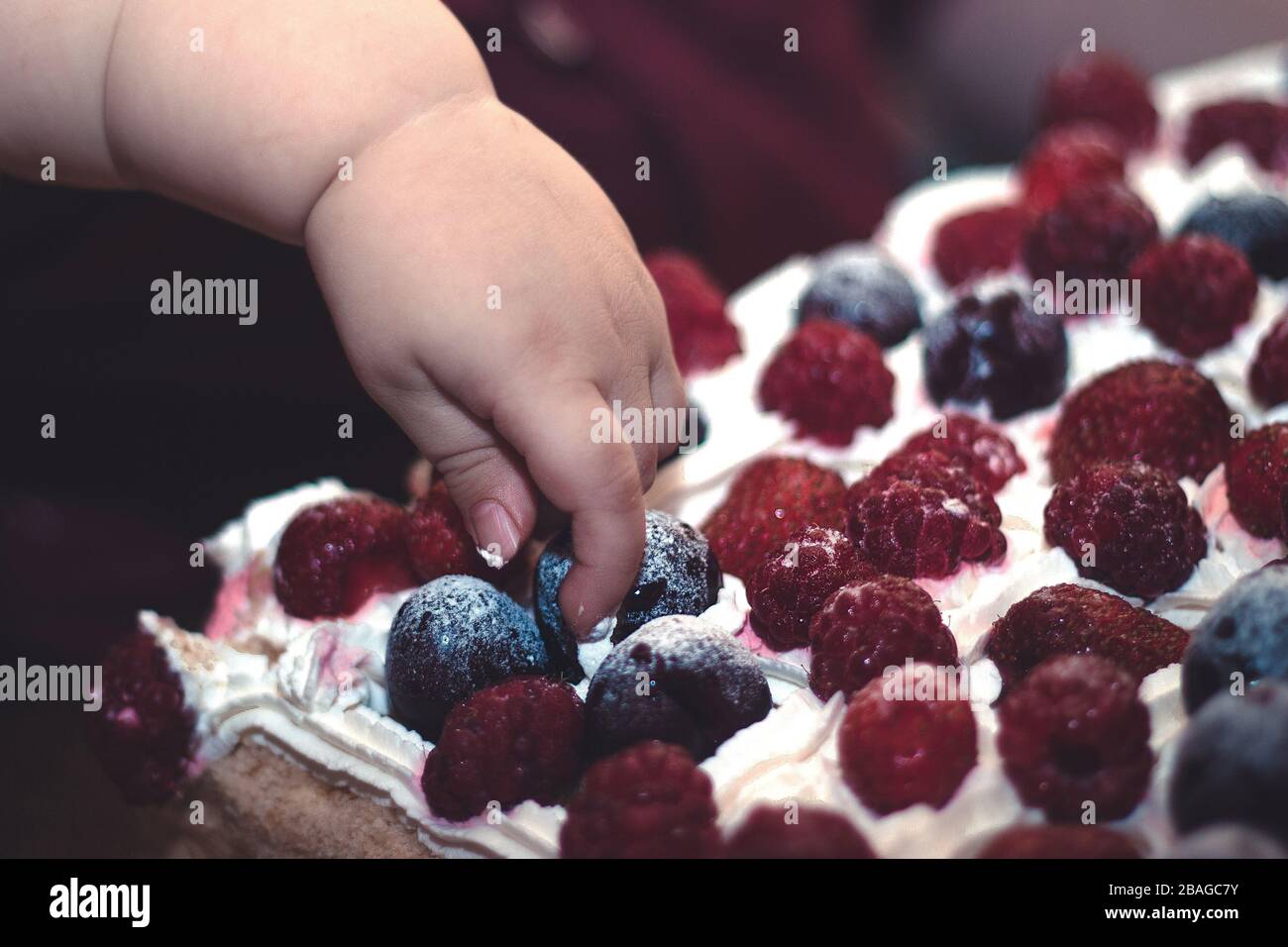 Hand reaching cake hi-res stock photography and images - Alamy