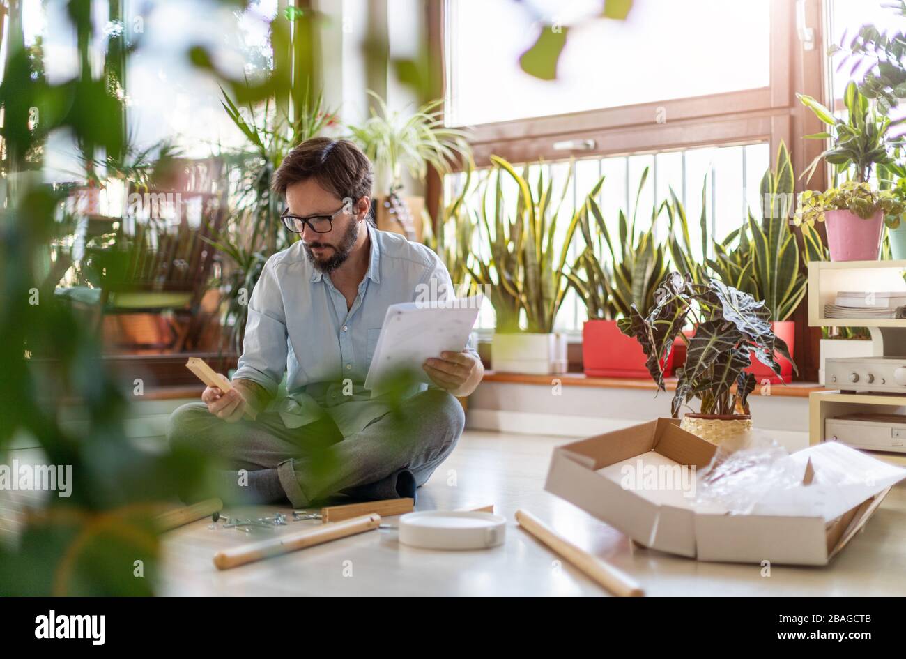 Man working on a D.I.Y project at home Stock Photo - Alamy
