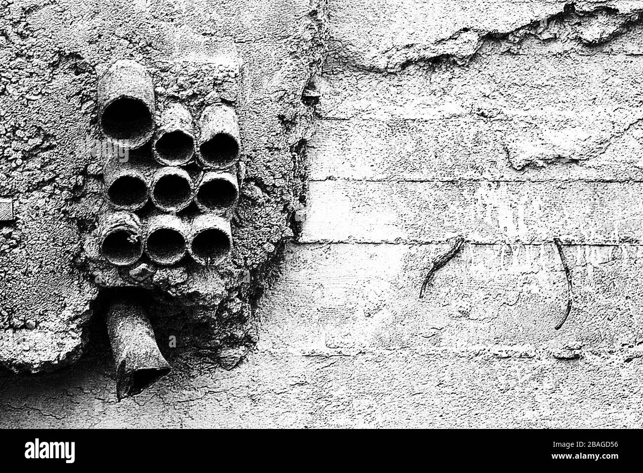 Incomplete pipe system on the factory wall Stock Photo - Alamy