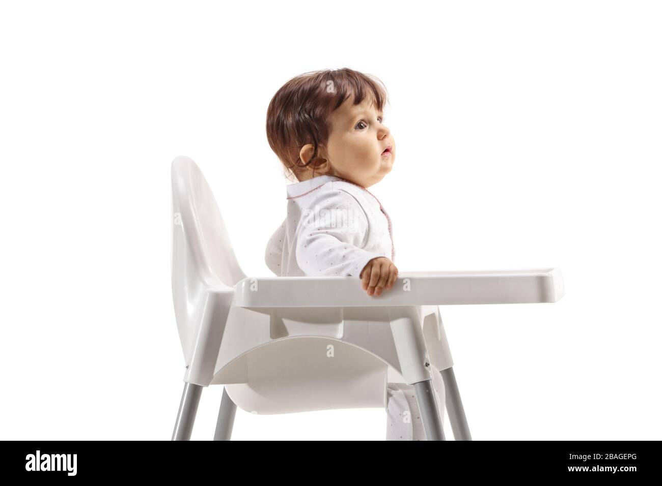 Baby girl sitting in a baby chair isolated on white background Stock ...