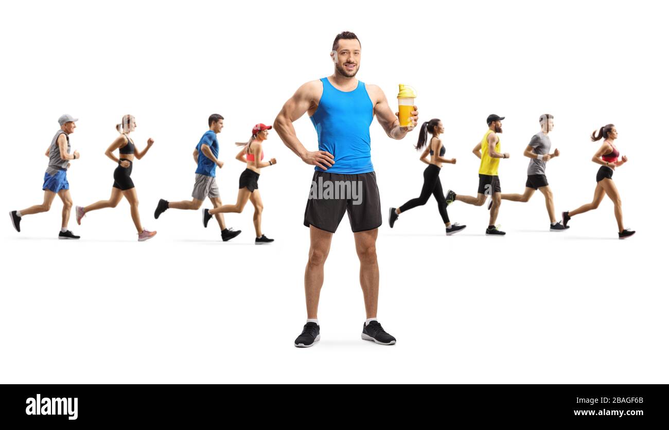 Full length portrait of a fit young man holding a protein shake and ...