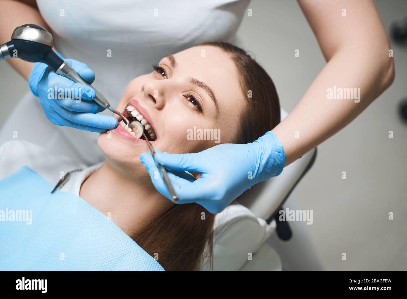 Young woman treating teeth in clinic stock photo Stock Photo - Alamy