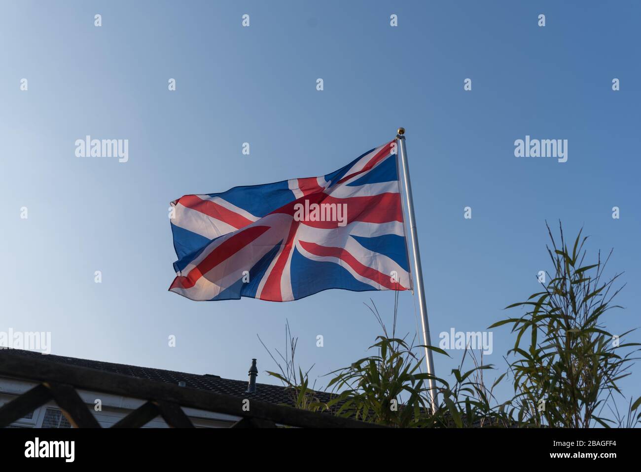 Union jack flag flapping in the wind hi-res stock photography and ...