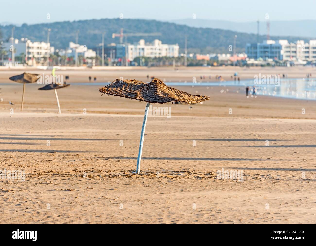 Parasol on the sandy beach, Essaouira, Morocco Stock Photo - Alamy