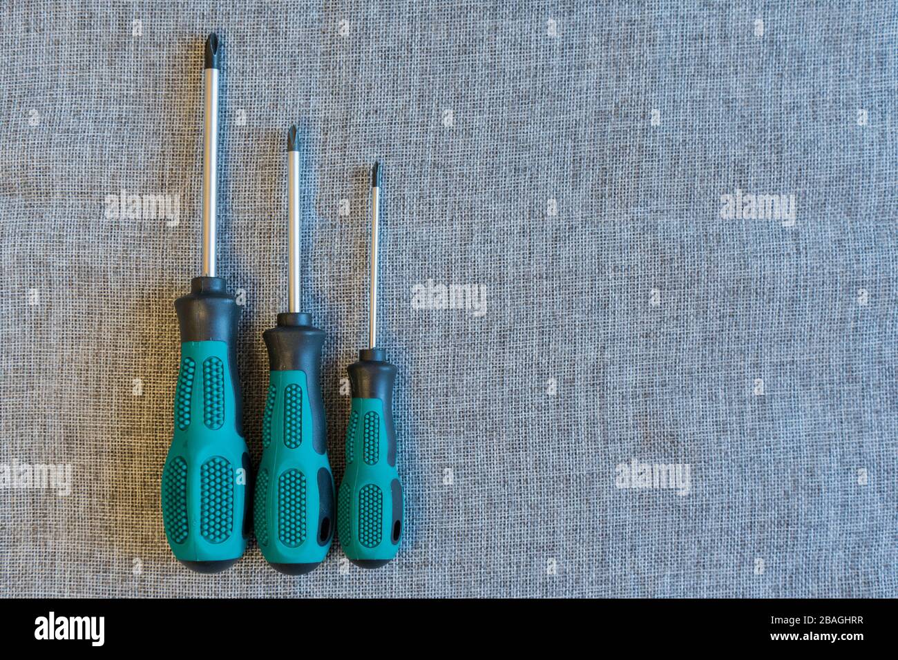 Various screwdrivers on a gray background. Repair concept Stock Photo ...