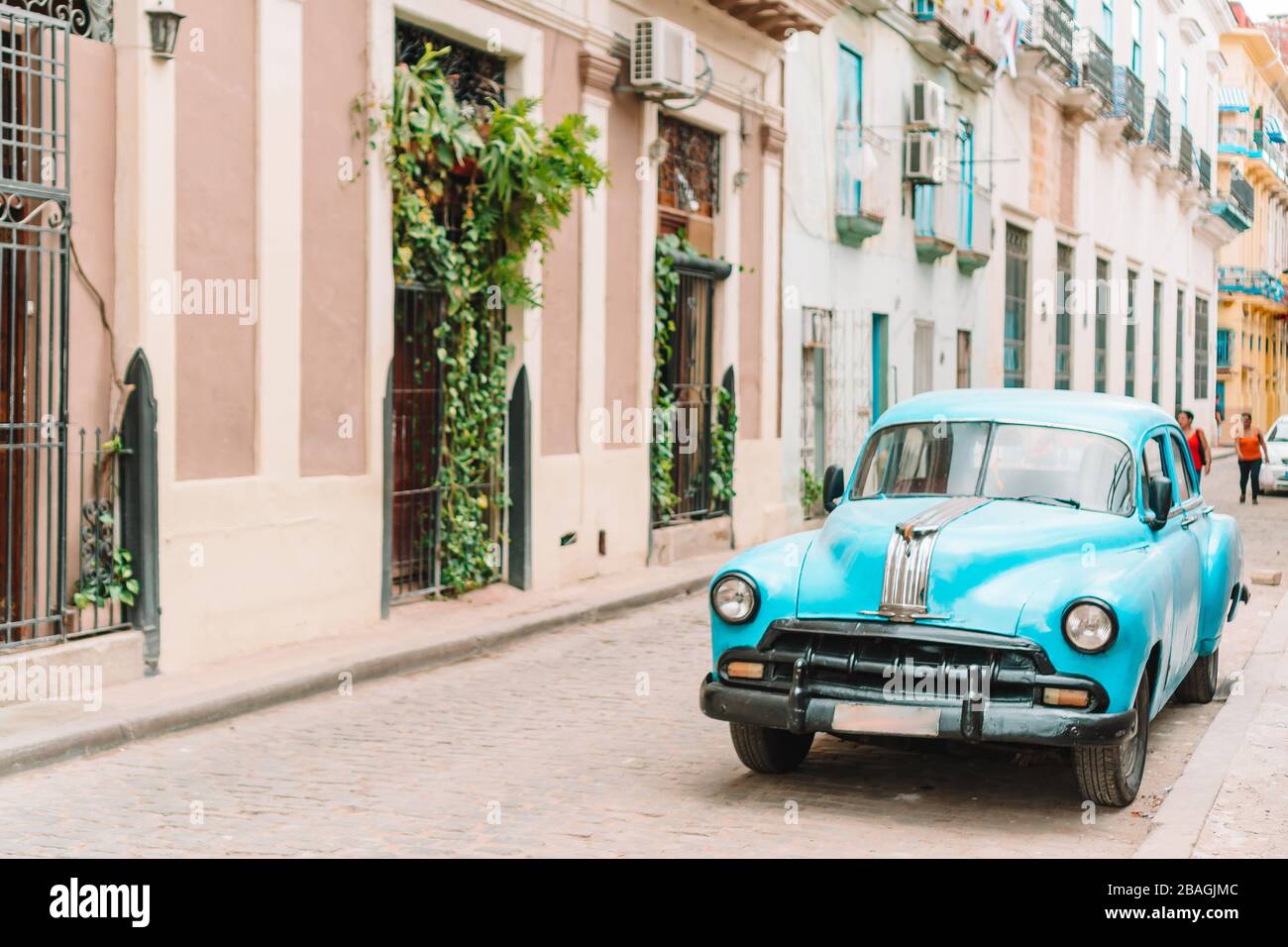View of yellow classic vintage car in Old Havana, Cuba Stock Photo - Alamy